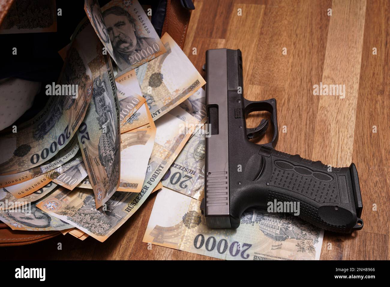Money On Table With Gun