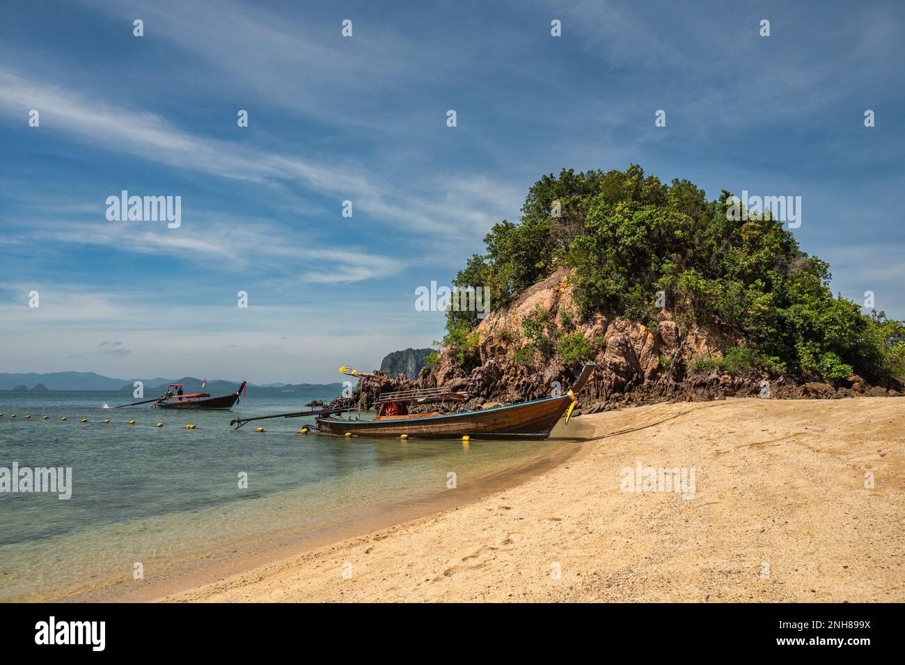 Tropical islands view with long tail boat ocean blue sea water and ...