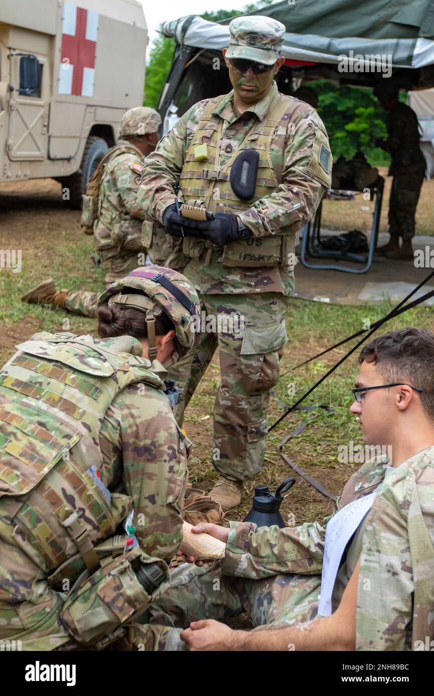 Sgt. 1st Class Rocky Mosley, center, medical operations observer, coach ...