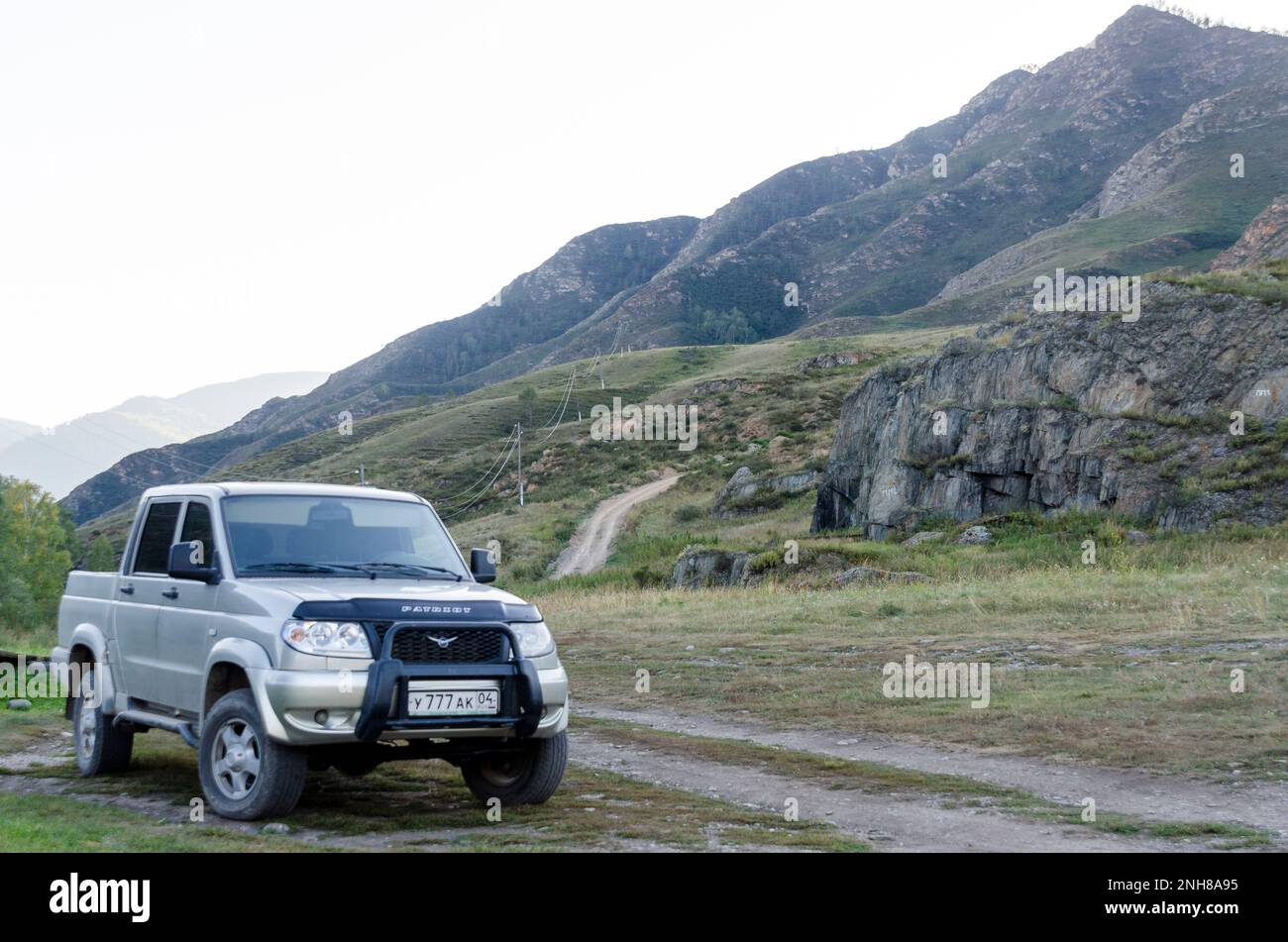 Operating vehicle pickup truck "UAZ Patriot" is parked on the grass at ...
