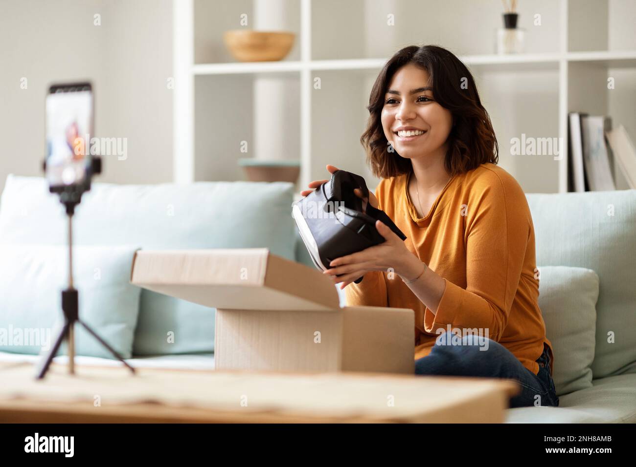 Tech Product Review. Arab Female Unboxing Parcel With VR Glasses At ...