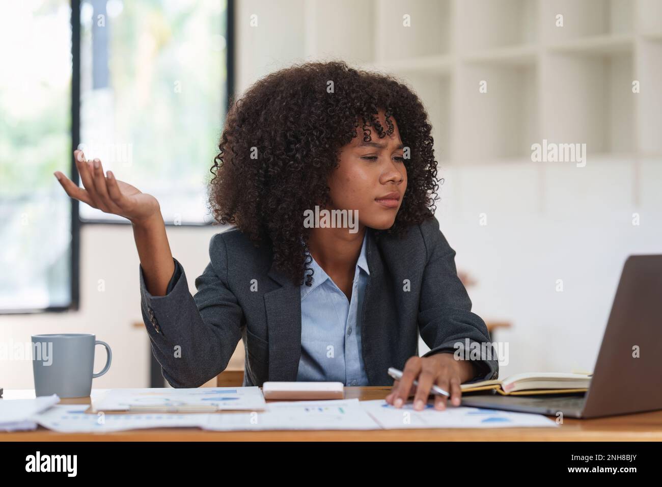 Portrait thoughtful confused young african american businesswoman ...