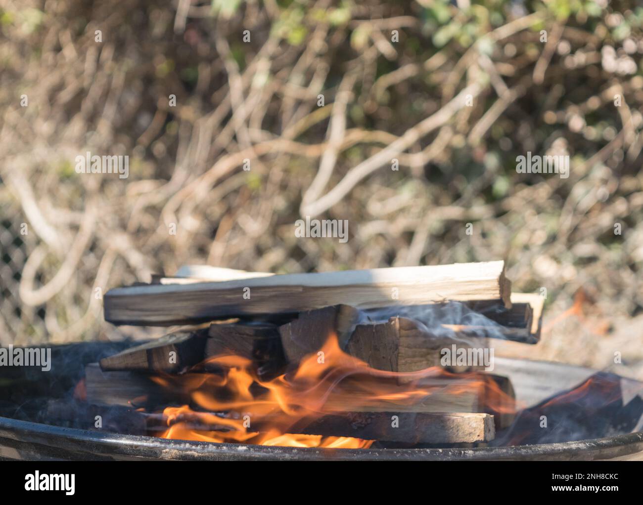 barbeque grill wood on fire Stock Photo - Alamy