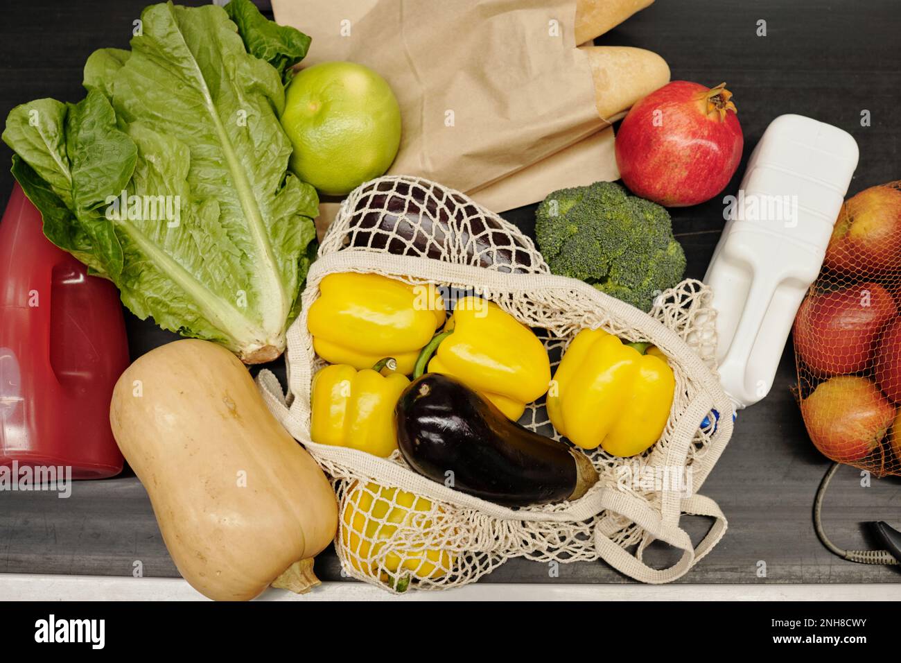 Top view of fresh vegetables and fruits in bag, wheat bread in paper ...
