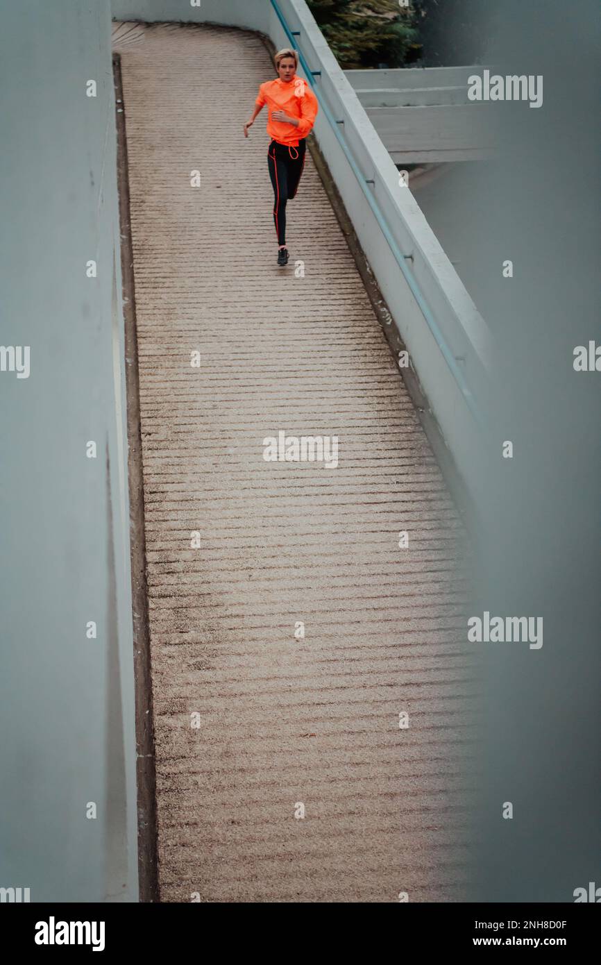 Top view photo of omen in sports clothes running in a modern urban ...