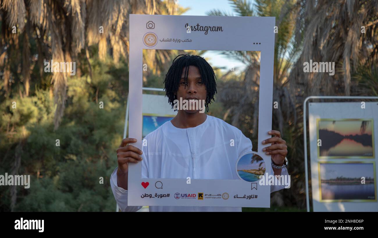 Participants take photos with special made selfie frames to celebrate ...