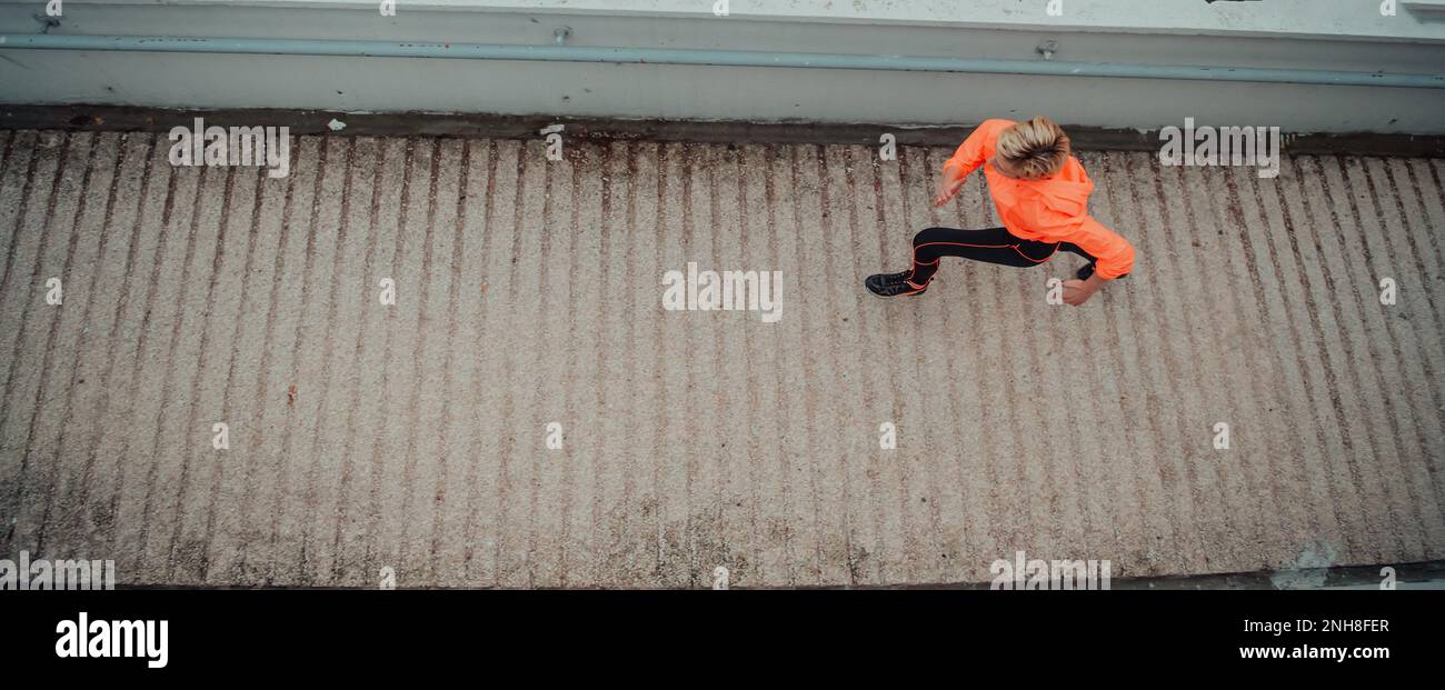 Top view photo of omen in sports clothes running in a modern urban ...
