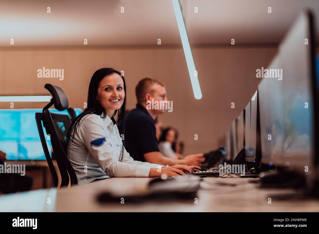 Group of Security data center operators working in a CCTV monitoring ...