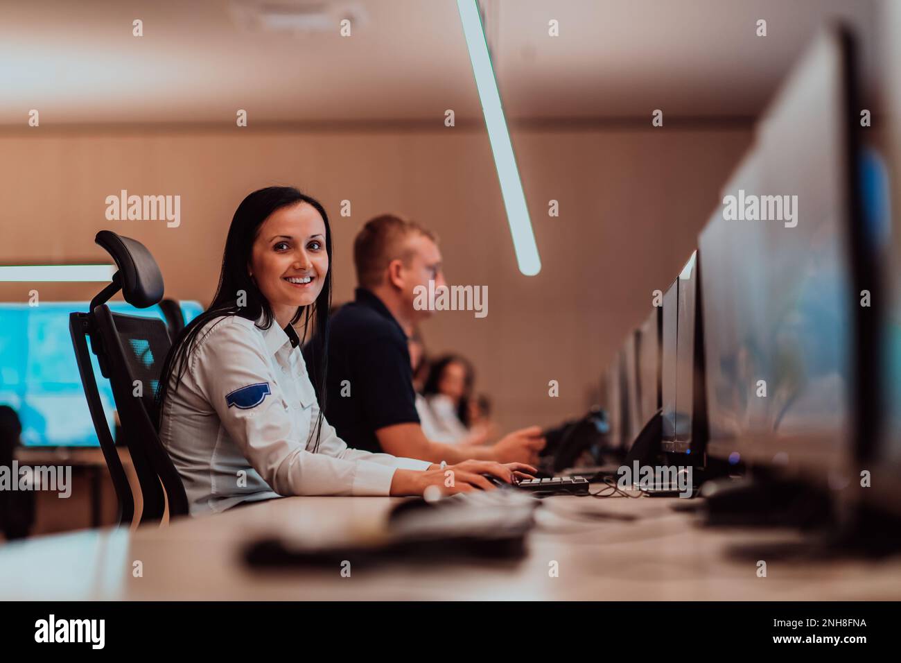 Group of Security data center operators working in a CCTV monitoring ...