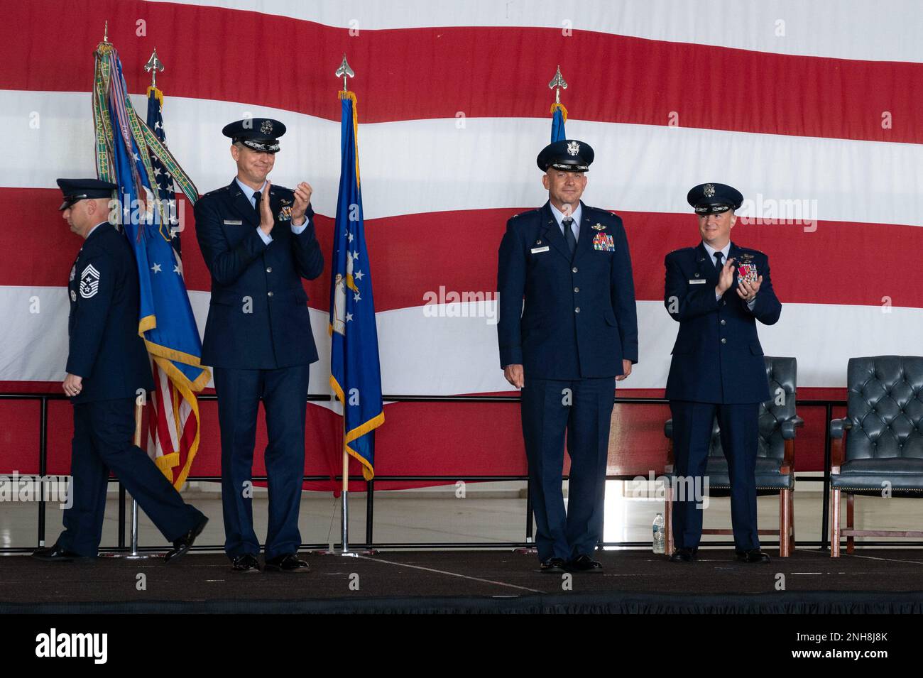 U.S. Air Force Col. Kevin Davidson stands at attention after becoming ...