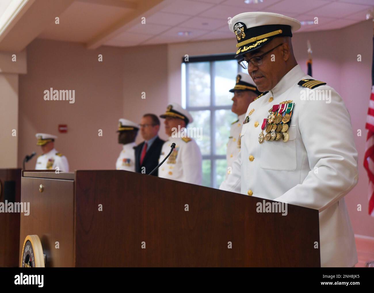 U.S. Navy Captain Reginald S. Ewing III gives his departing remarks ...
