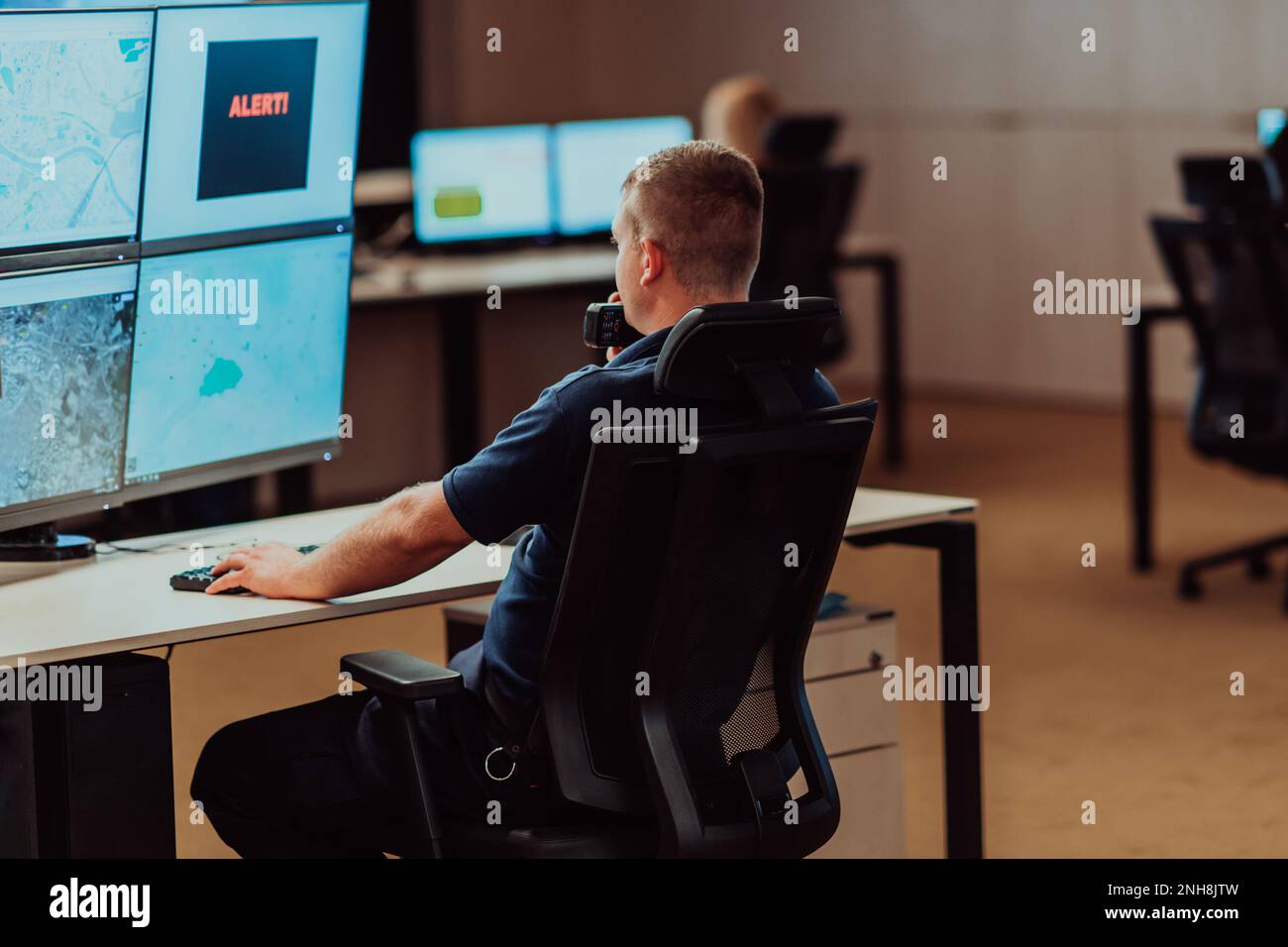 Group of Security data center operators working in a CCTV monitoring ...