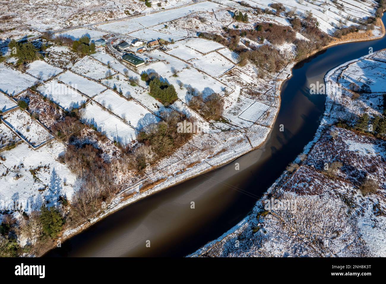 Aerial view of snow covered Gweebarra River between Doochary and ...