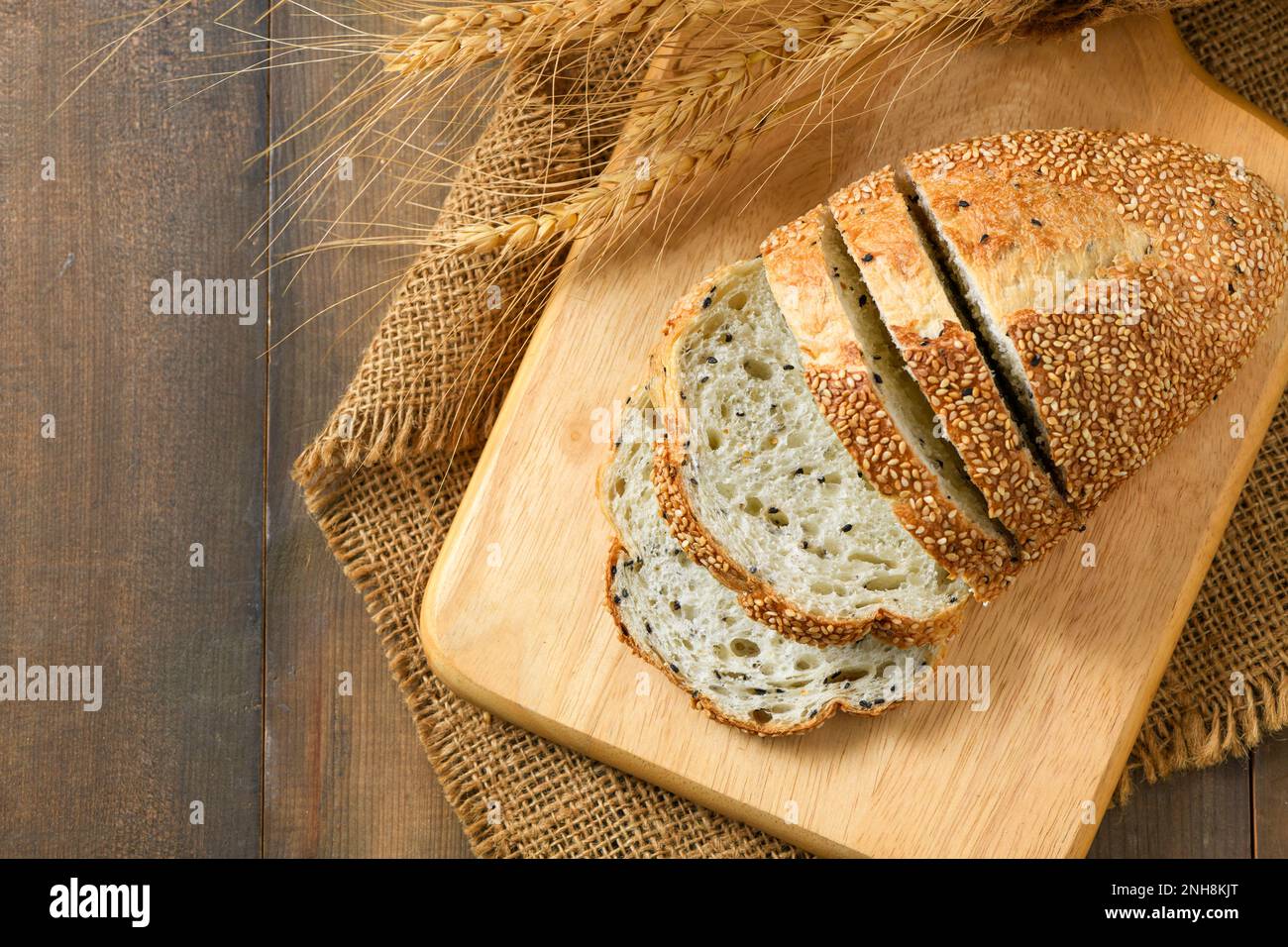 Top view of sliced french grain breads with white and black sesame on ...