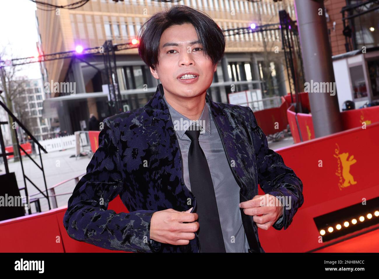 Berlin, Germany. 21st Feb, 2023. Ren Ke, actor, walks the red carpet ...