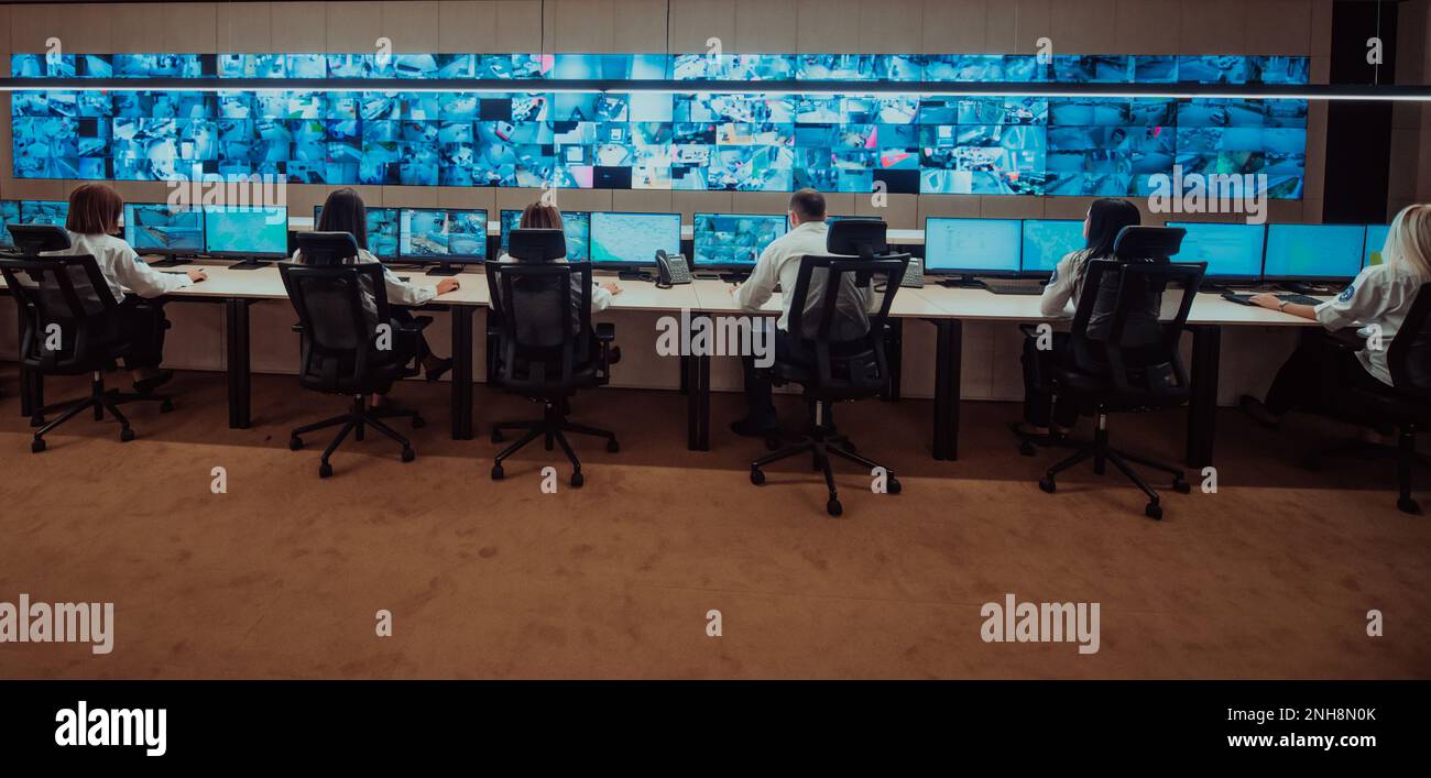 Group of Security data center operators working in a CCTV monitoring ...