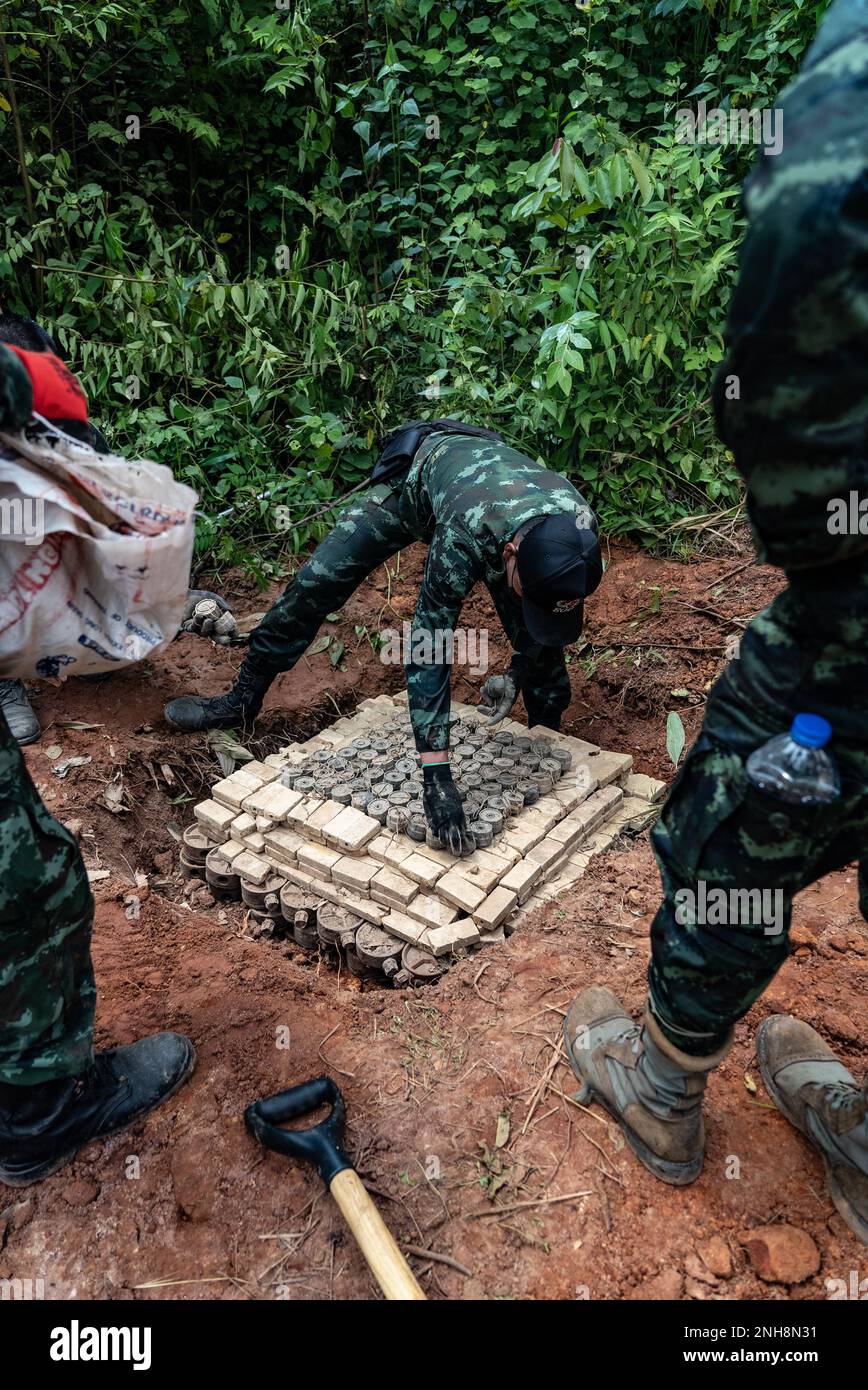 A Royal Thai Army Explosive Ordnance Disposal technician places anti ...