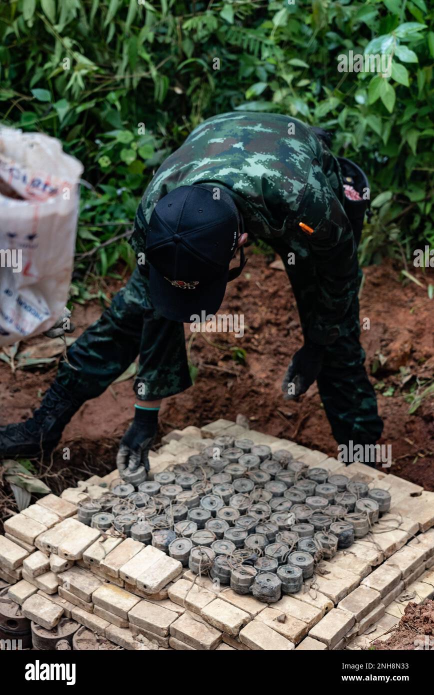 A Royal Thai Army Explosive Ordnance Disposal technician places anti ...