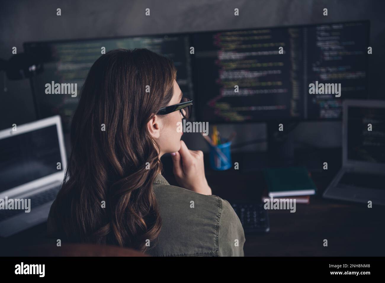 Photo of serious thoughtful lady hacker wear eyeglasses writing app ...