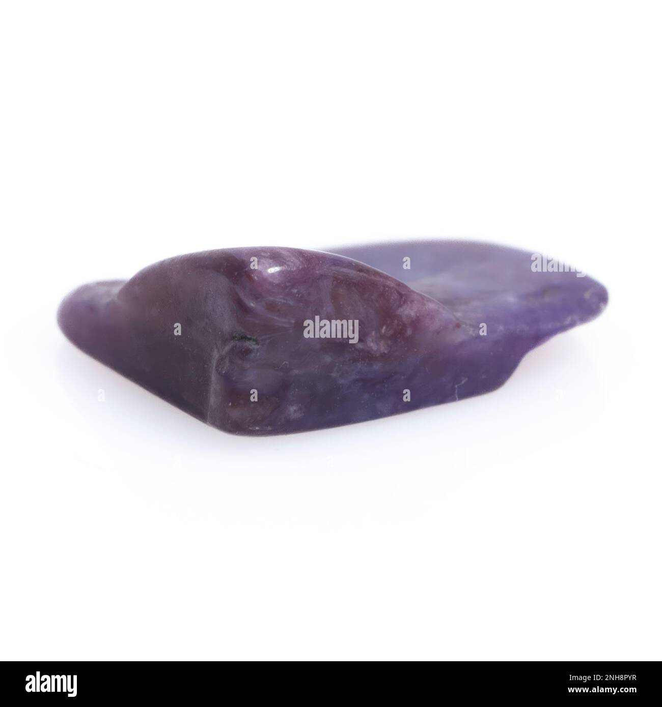 Natural gem purple charoite isolated on white background Stock Photo ...