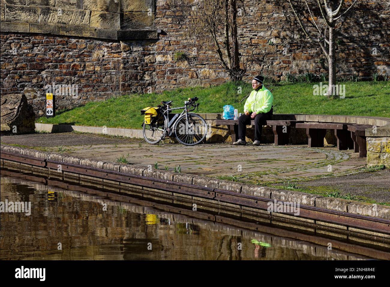 Cyclist resting at the Llangollen branch towpath of the Shropshire ...