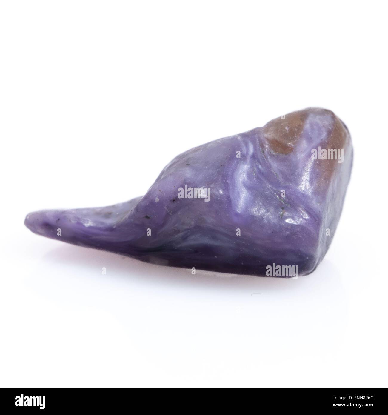 Natural gem purple charoite isolated on white background Stock Photo ...