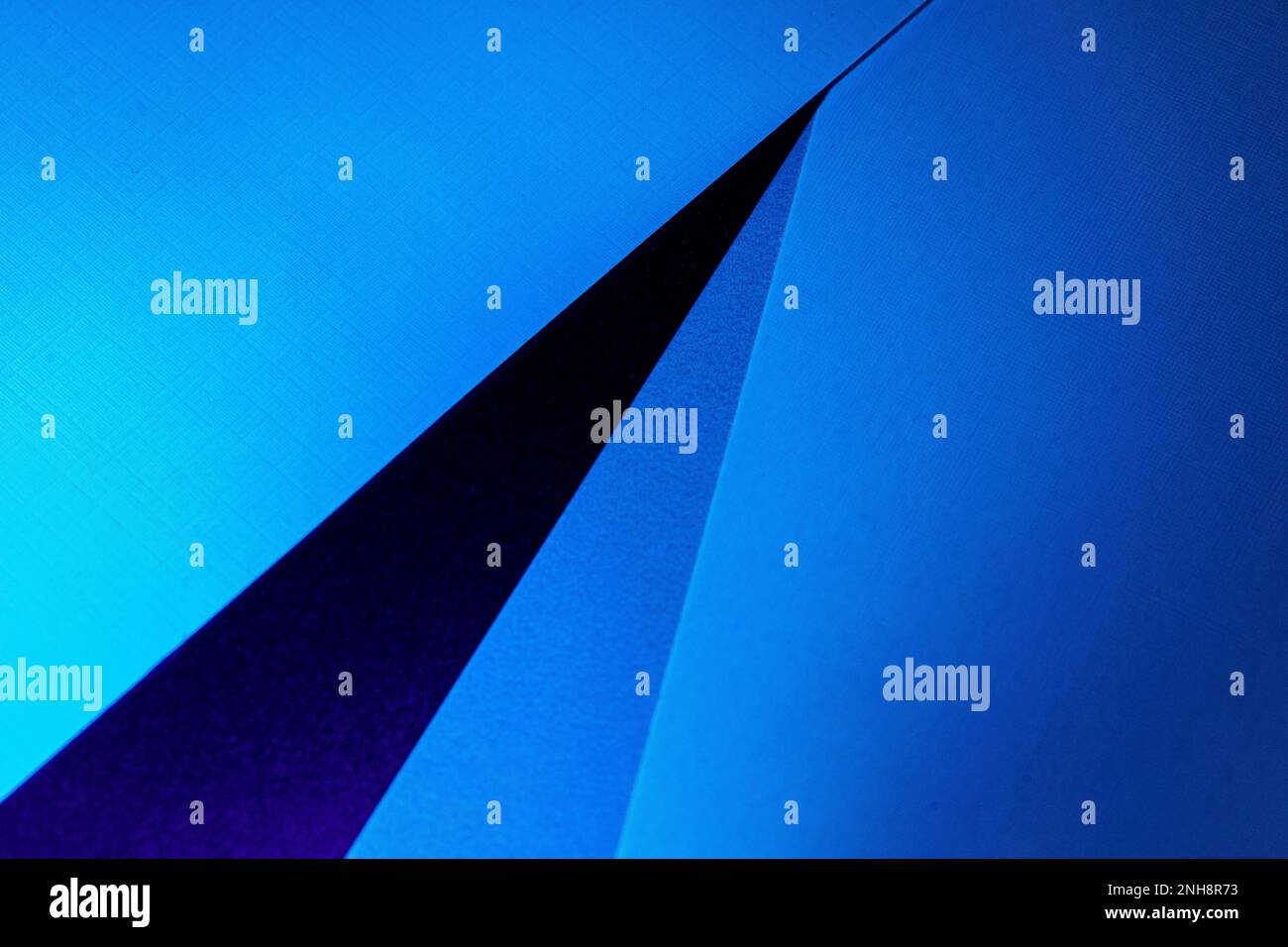 Blank carton paper sheets background in dark blue light Stock Photo - Alamy