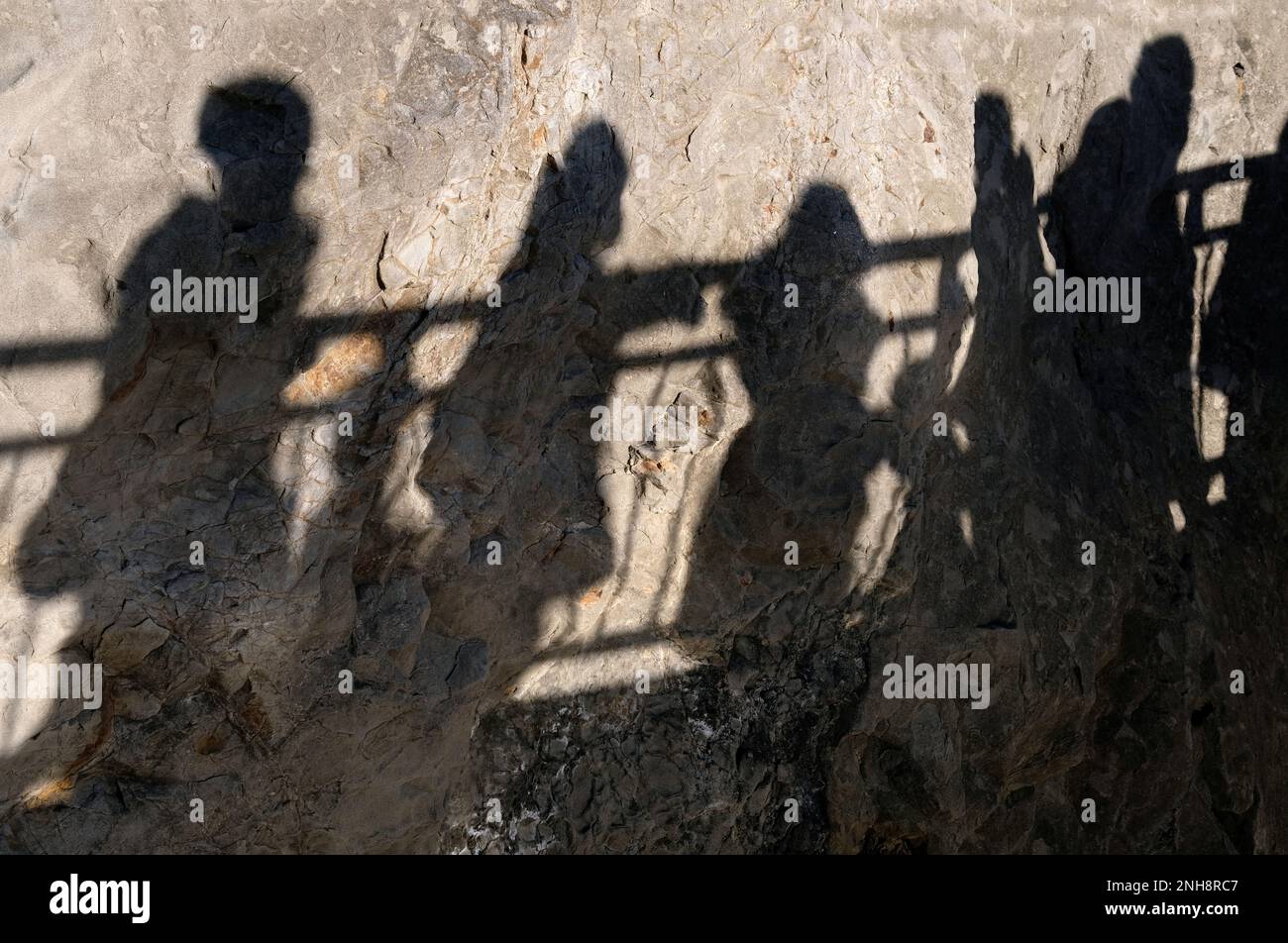 Shadow of a crowd of people on a cliff Stock Photo - Alamy