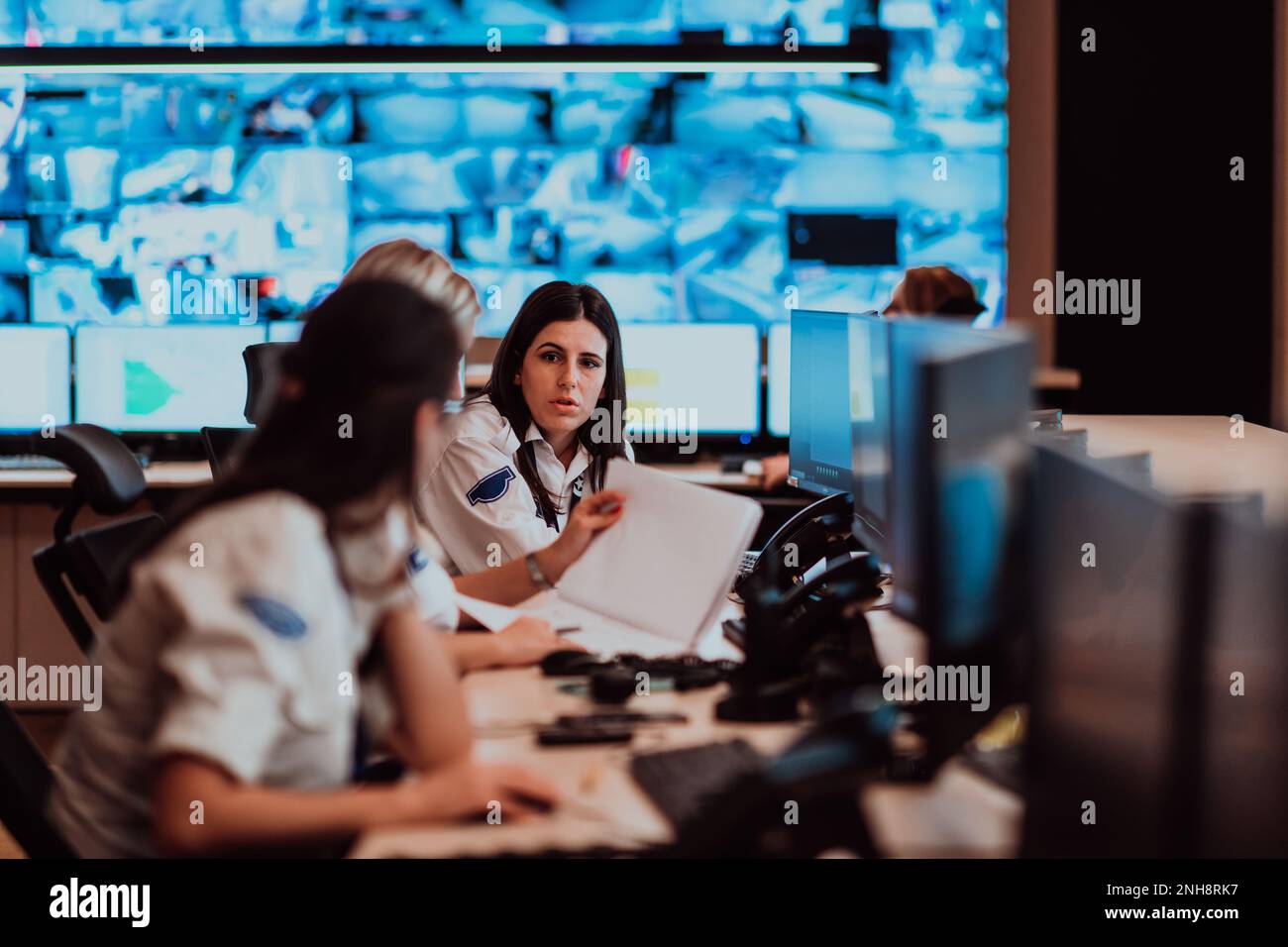Group of Security data center operators working in a CCTV monitoring ...
