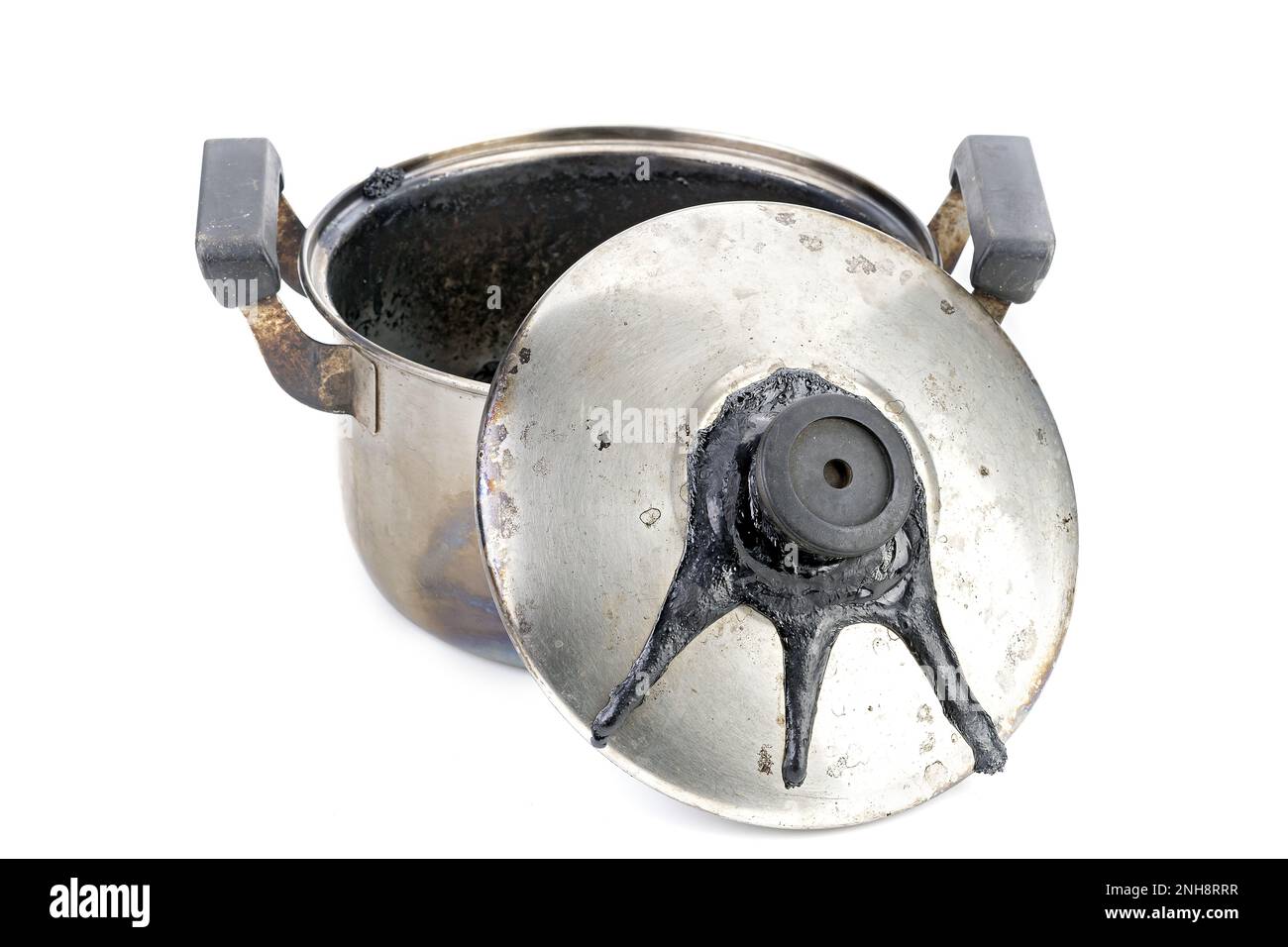 A stainless steel pot with burnt marks lid from being left on the stove ...