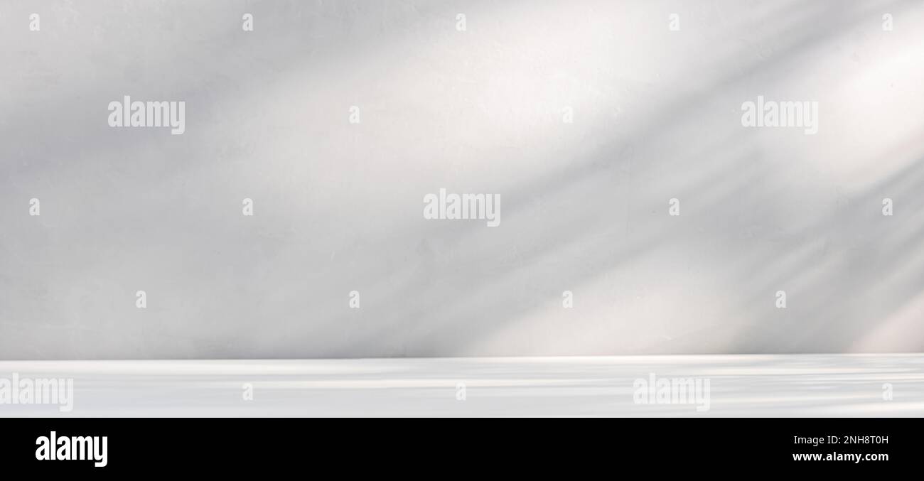 Sunlit concrete countertop and wall with natural light Stock Photo - Alamy