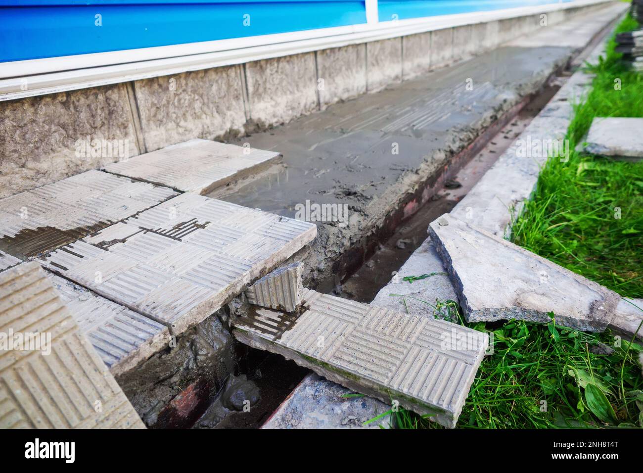 Replacement and repair of the blind area of the building. Laying stone ...