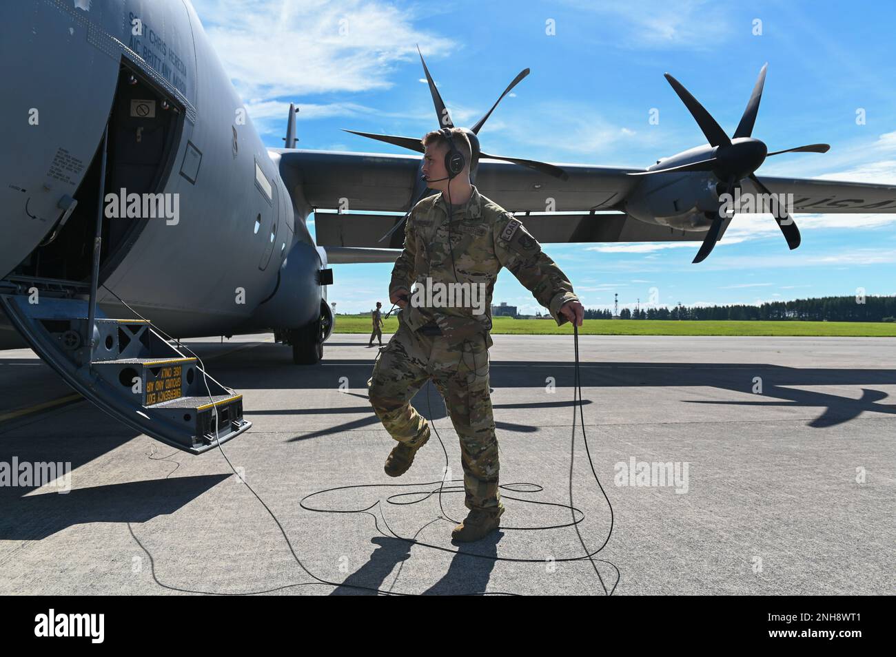 Senior Airman Carson Christian, 36th Airlift Squadron loadmaster, performs pre-flight checks on ...