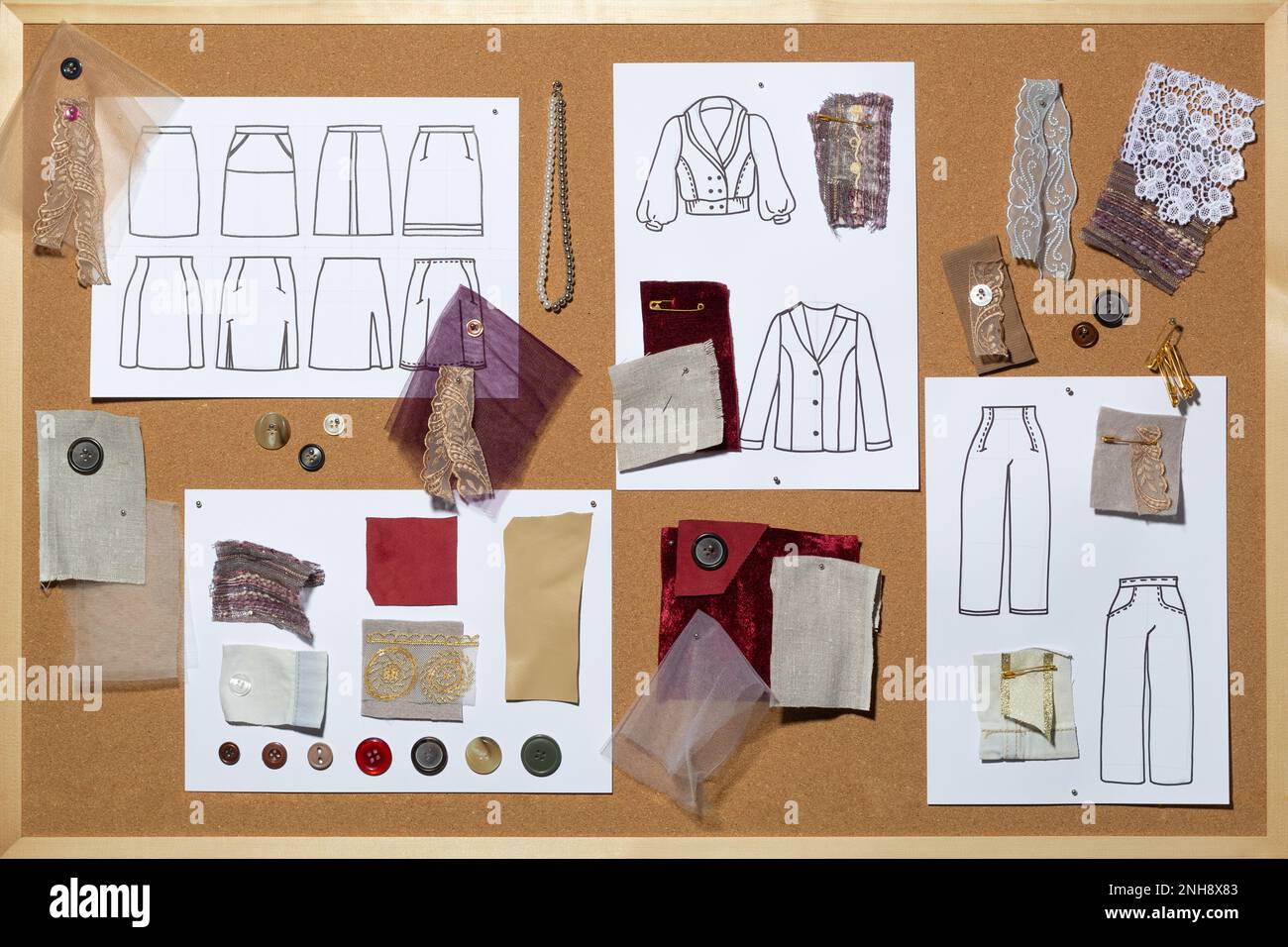 Design sketches and fabric samples for sewing clothes on a cork board ...