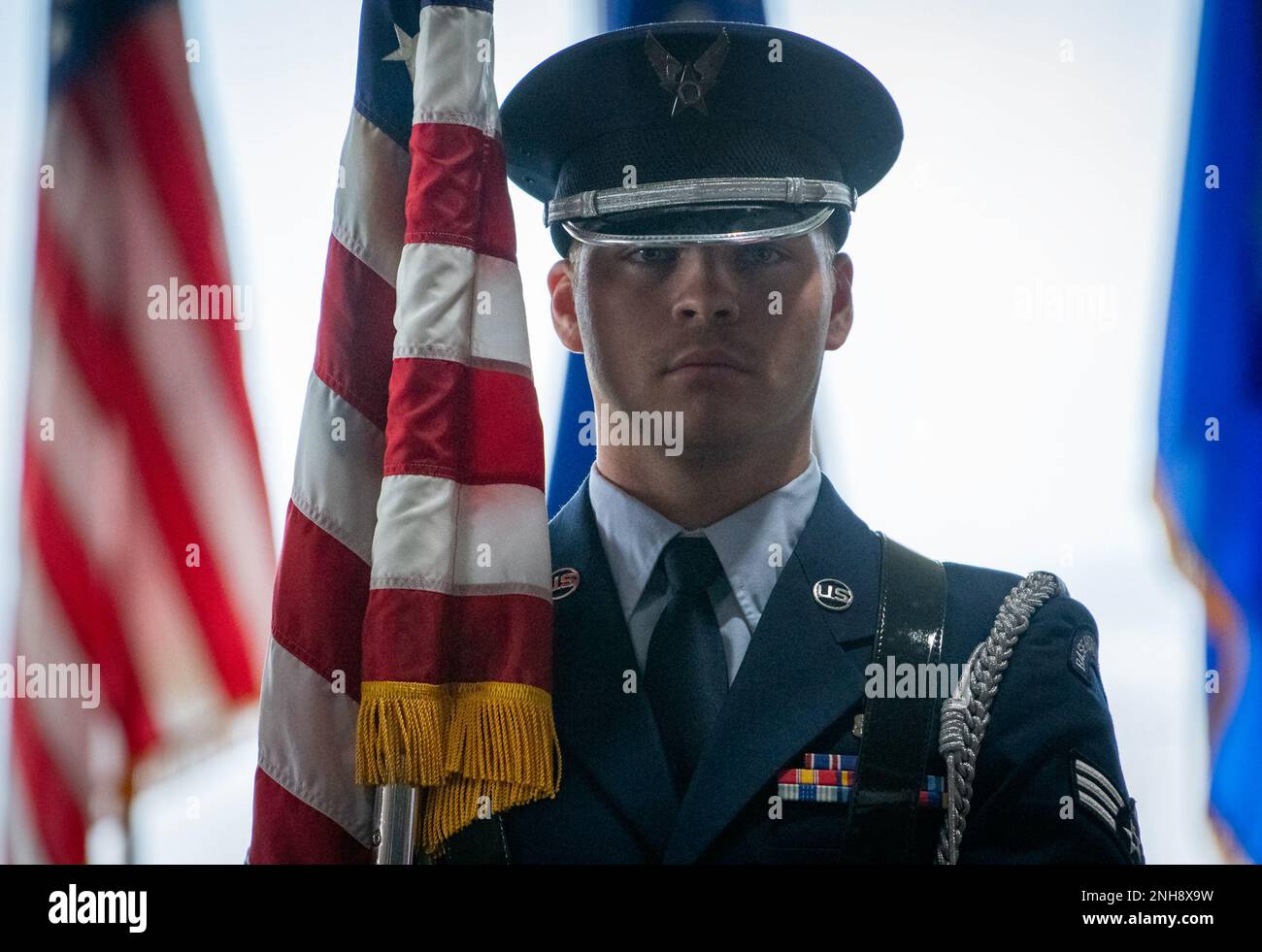Senior Airman Jake Sheppard, Eglin Honor Guard, holds the American flag ...
