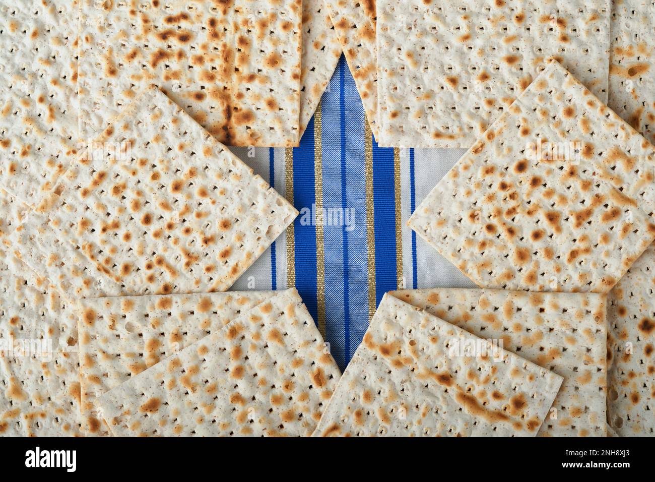Passover celebration concept. Blue Star of David made from matzah ...