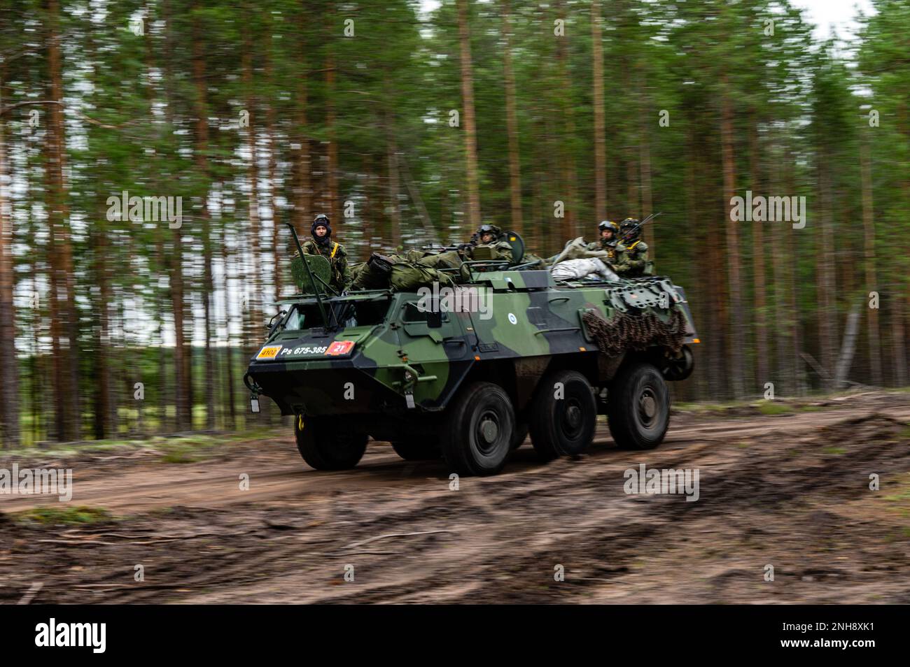 Finnish soldiers with the Pori Brigade readiness unit maneuver in a ...