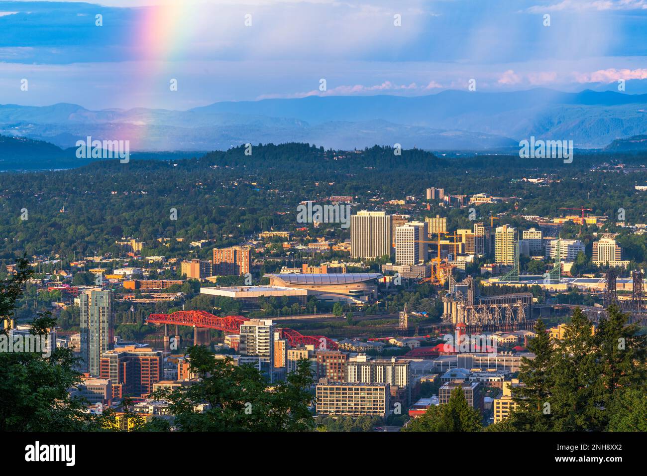 Portland, Oregon, USA downtown cityscape with a sun shower and rainbow ...