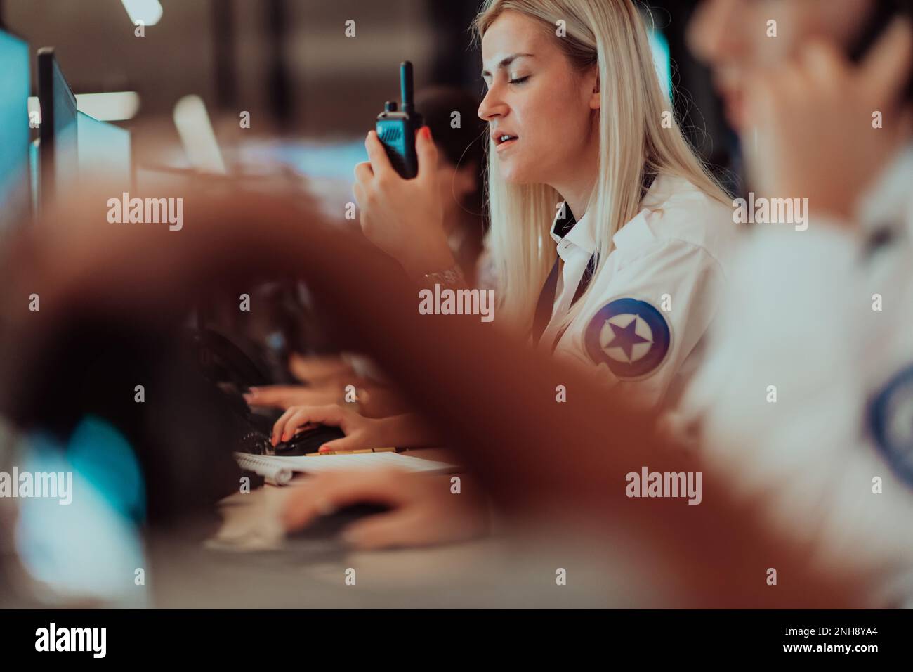 Group of Security data center operators working in a CCTV monitoring ...
