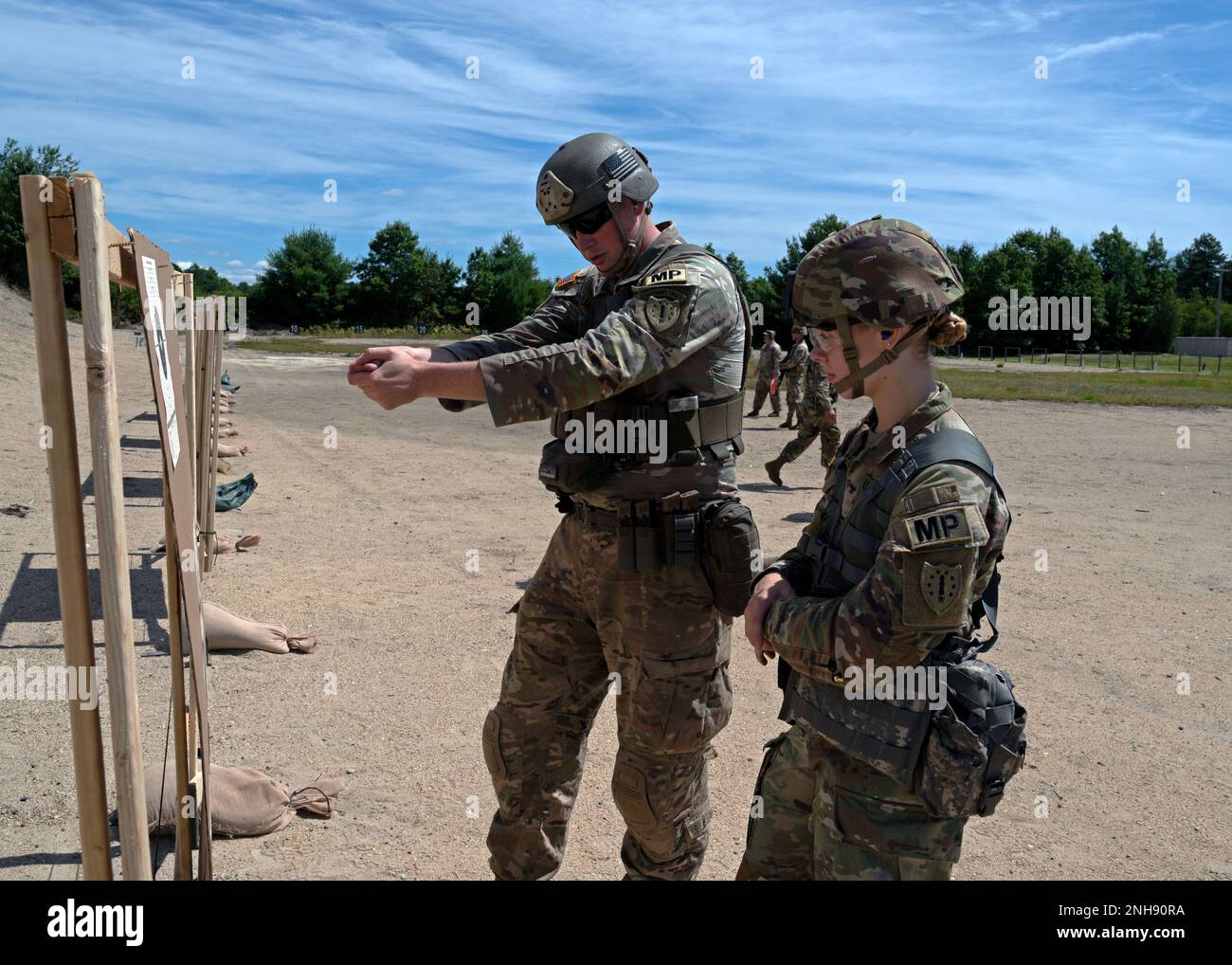 Staff Sgt. Tim Huntley of 12th Civil Support Team, New Hampshire National Guard, coaches Pfc ...