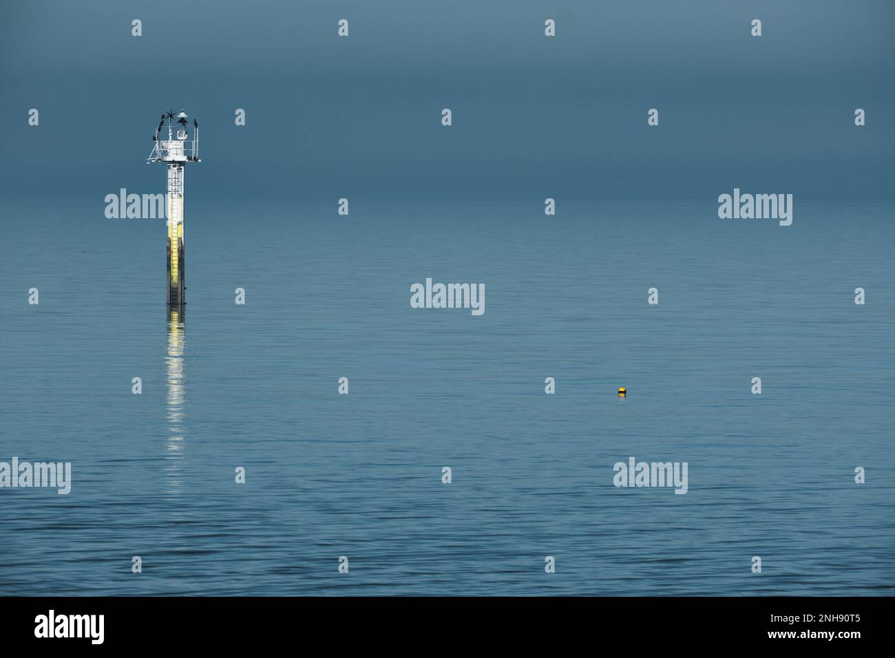 Channel marker in Margate Harbour, Kent on a Winter day Stock Photo - Alamy