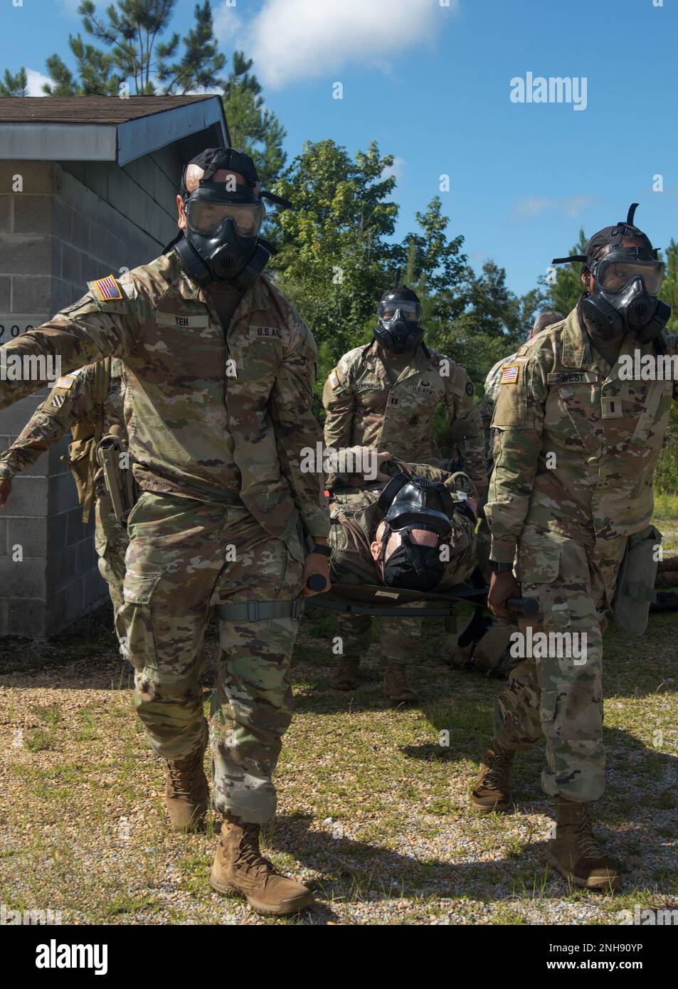 Soldiers from the 290th Military Police Brigade evacuates a casualty ...