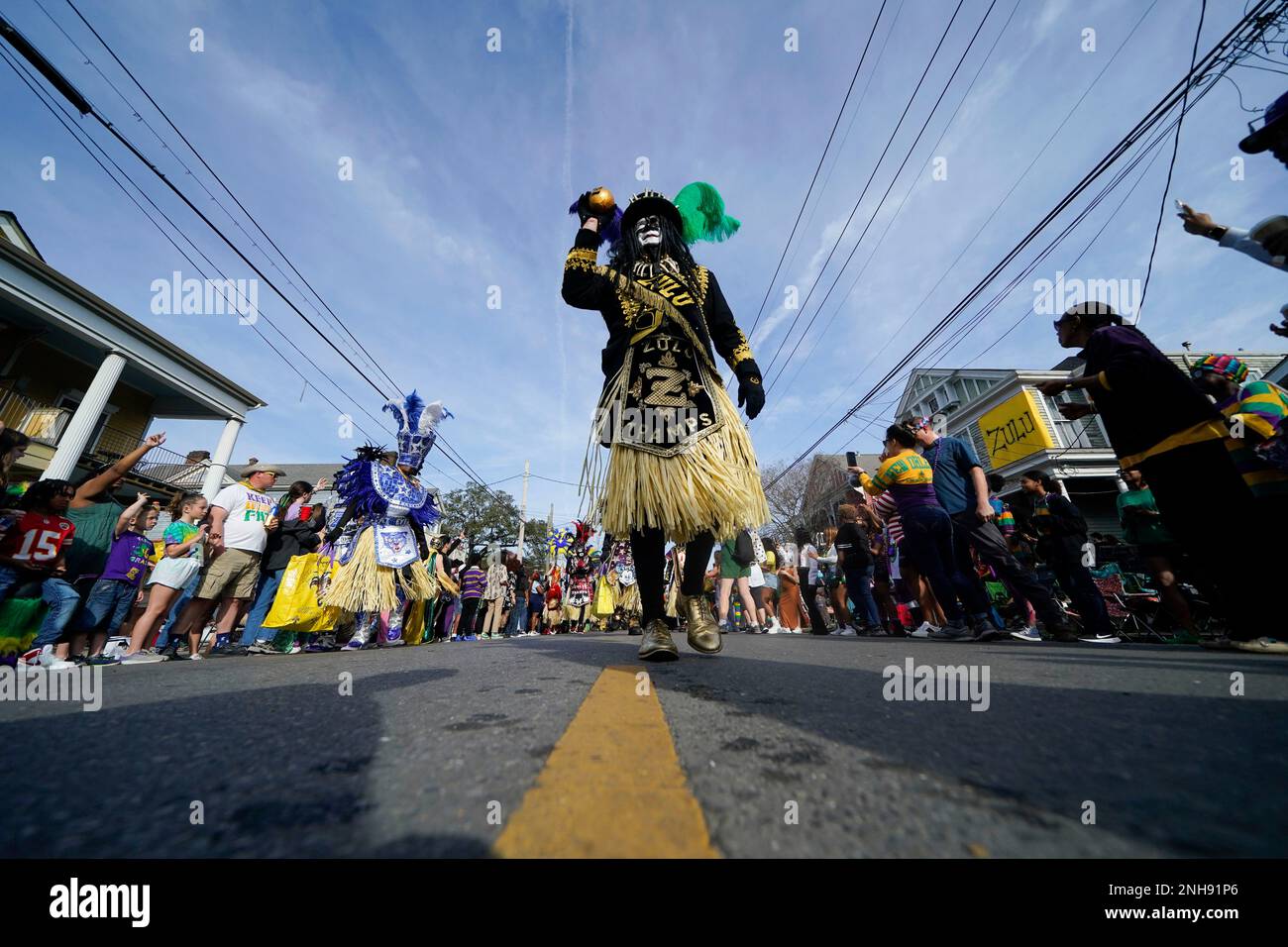 A member of the traditional Mardi Gras group The Tramps marches during ...