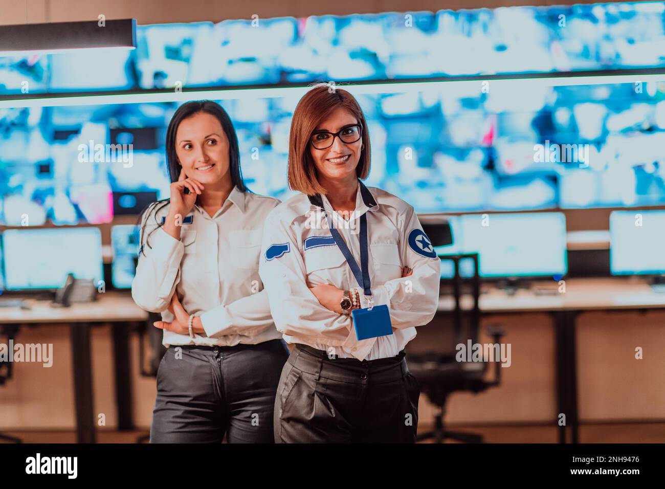 Group portrait of female security operator while working in a data ...