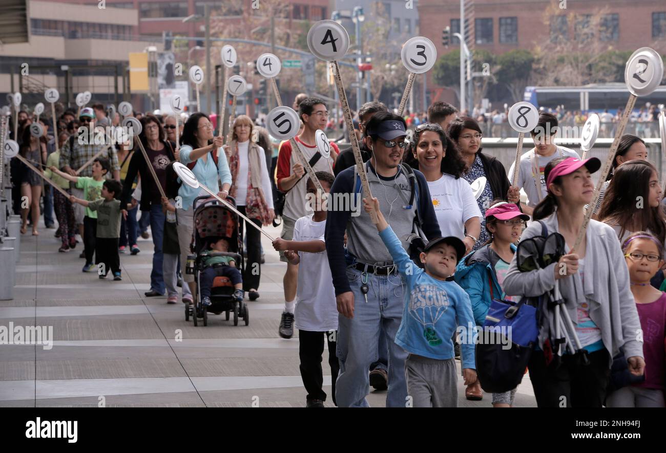 A parade of numbers circle Piers 15 and 17 during a celebration of Pi ...
