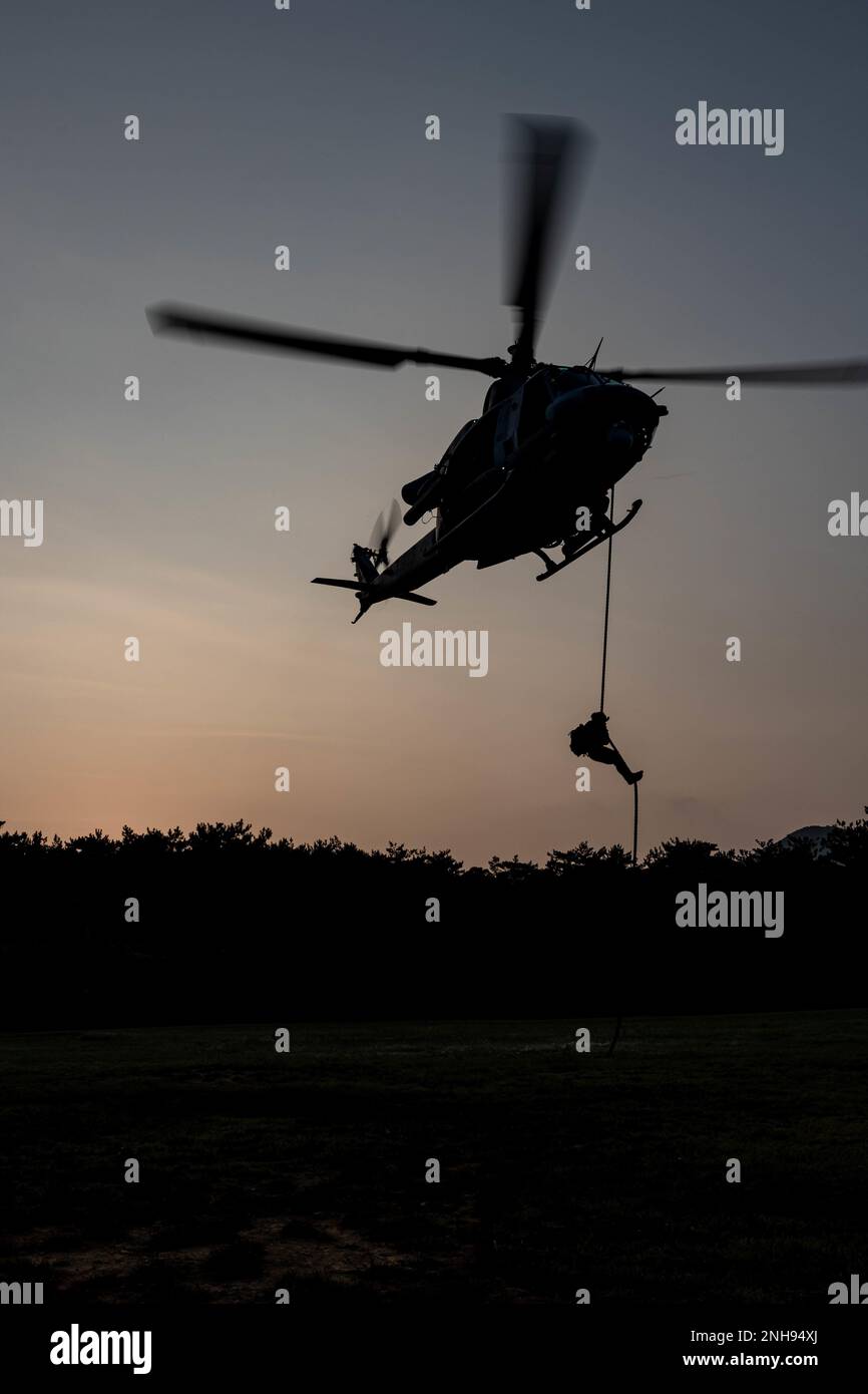 U.S. Marines with Marine Wing Support Squadron (MWSS) 171 fast rope out ...