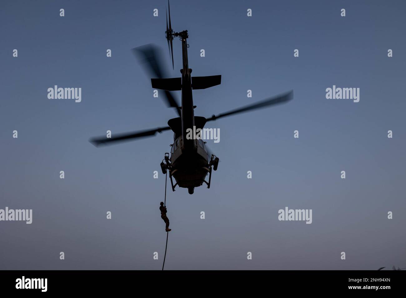 U.S. Marines with Marine Wing Support Squadron (MWSS) 171 fast rope out ...