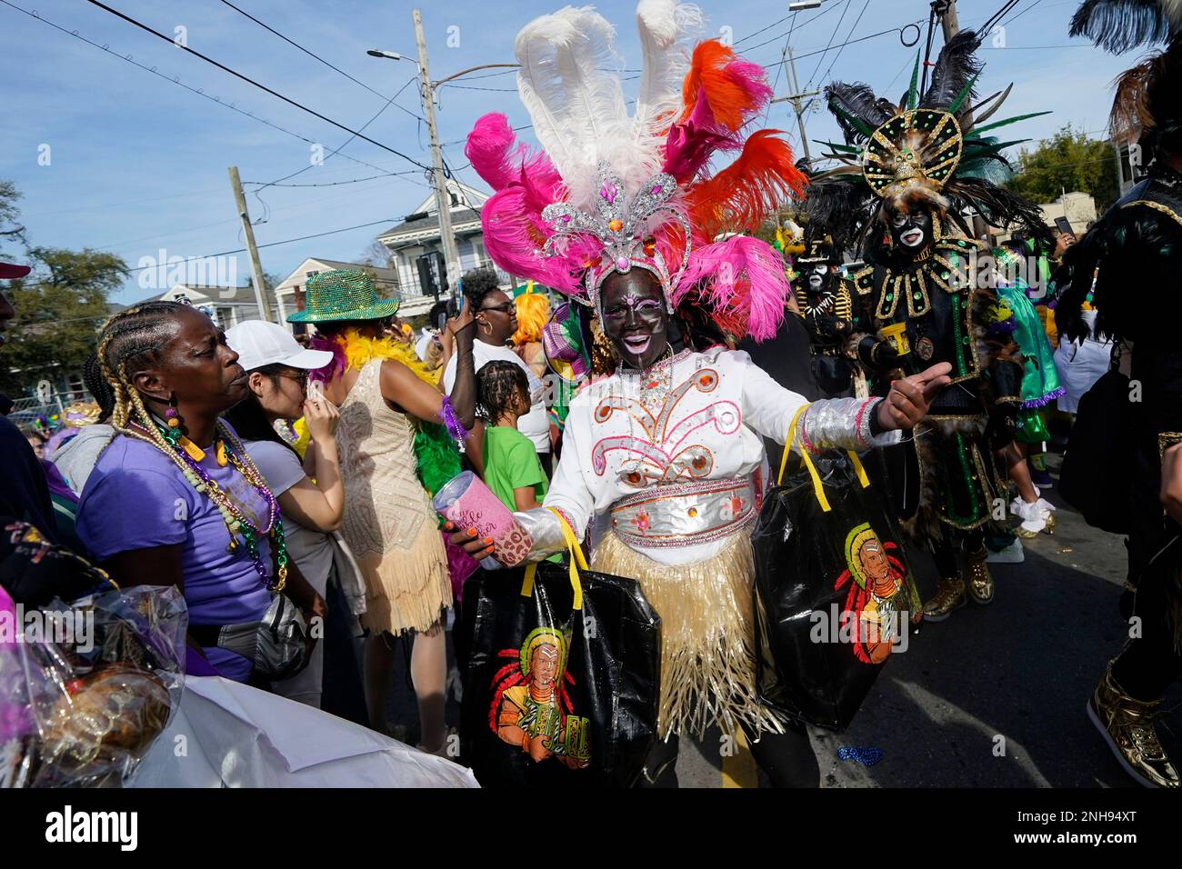 A member of the traditional Mardi Gras group The Tramps marches during ...