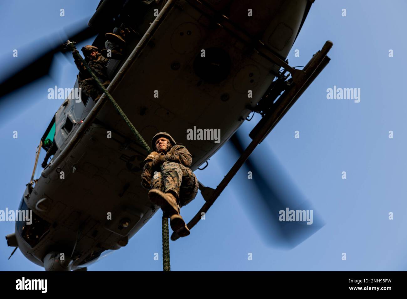 U.S. Marines with Marine Wing Support Squadron (MWSS) 171 fast rope out ...