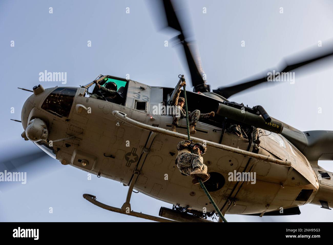 U.S. Marines with Marine Wing Support Squadron (MWSS) 171 fast rope out ...
